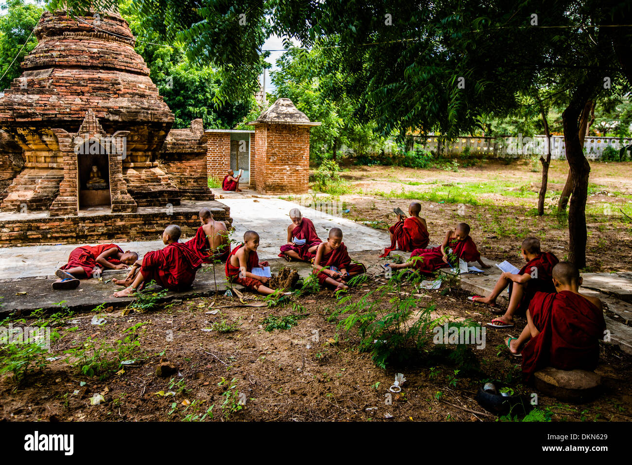 Novice monks study on the grounds of their monastery, Bagan, Myanmar ...