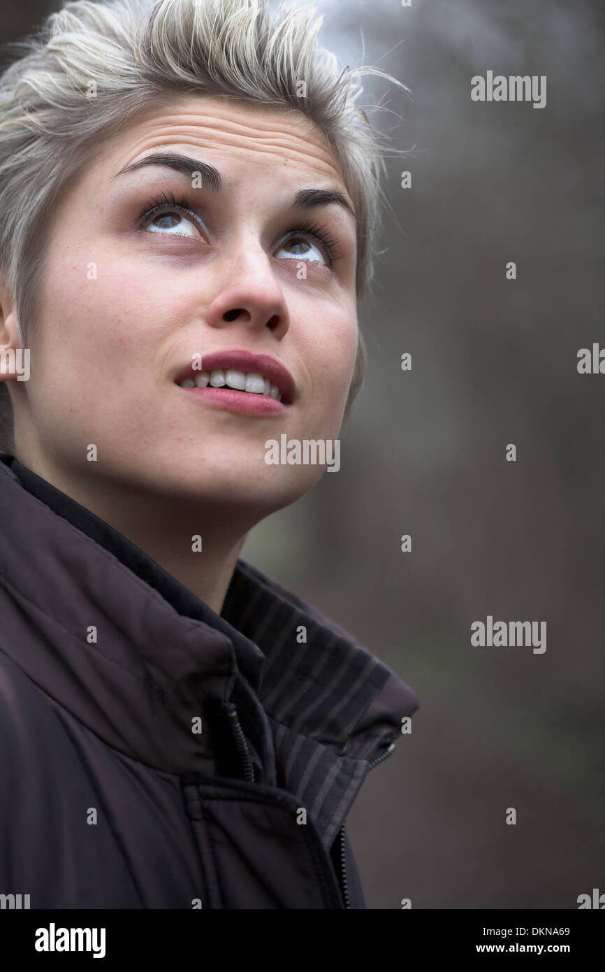 pretty woman outdoor with various facial expressions looking up Stock ...
