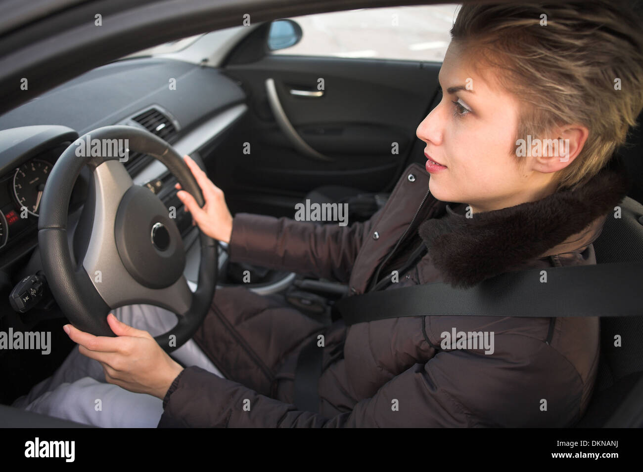 pretty woman driving a car hands on the wheel Stock Photo - Alamy
