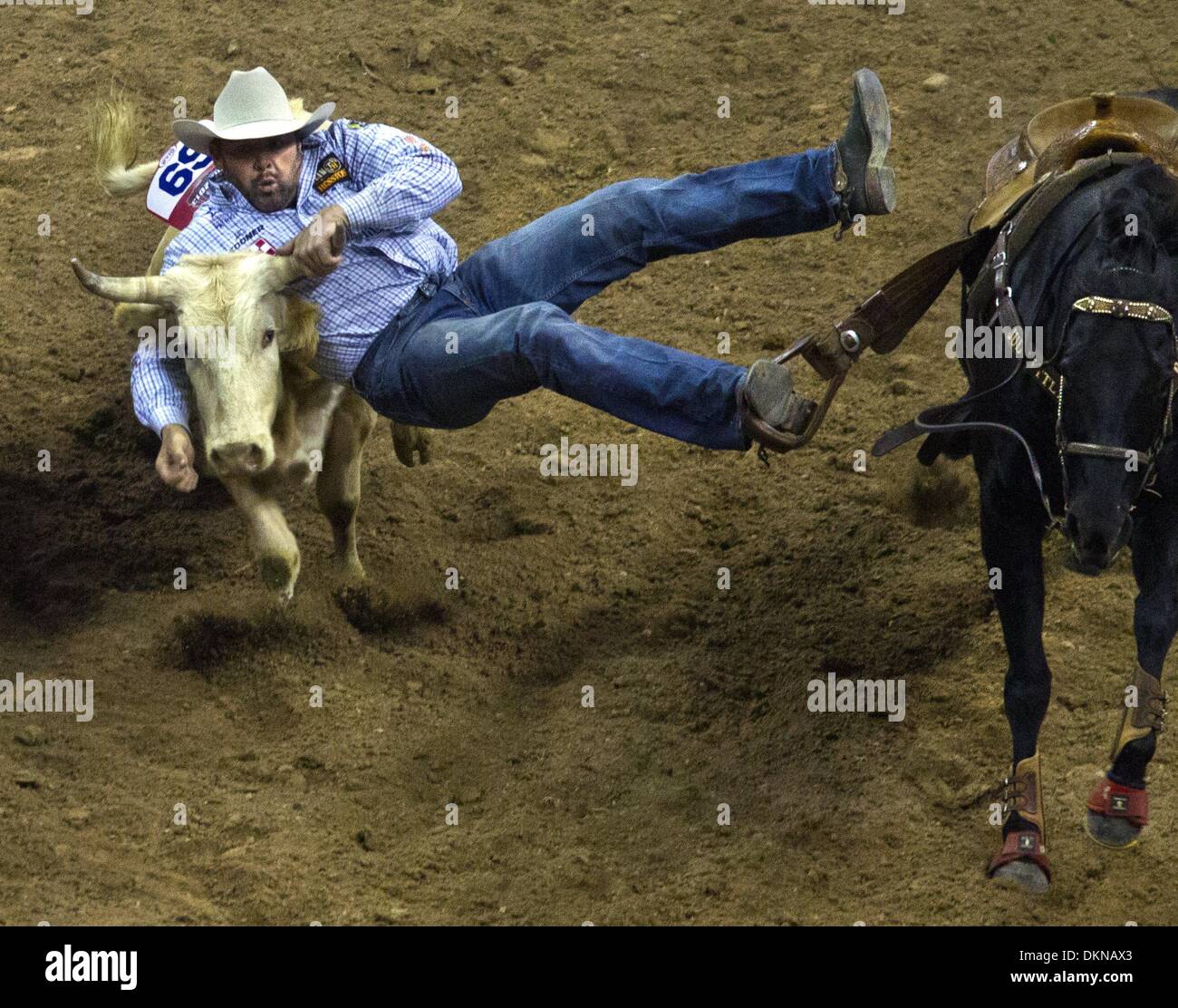 Las Vegas, Nevada, USA. 7th Dec, 2013. Steer wrestler K.C. Jones leaves ...