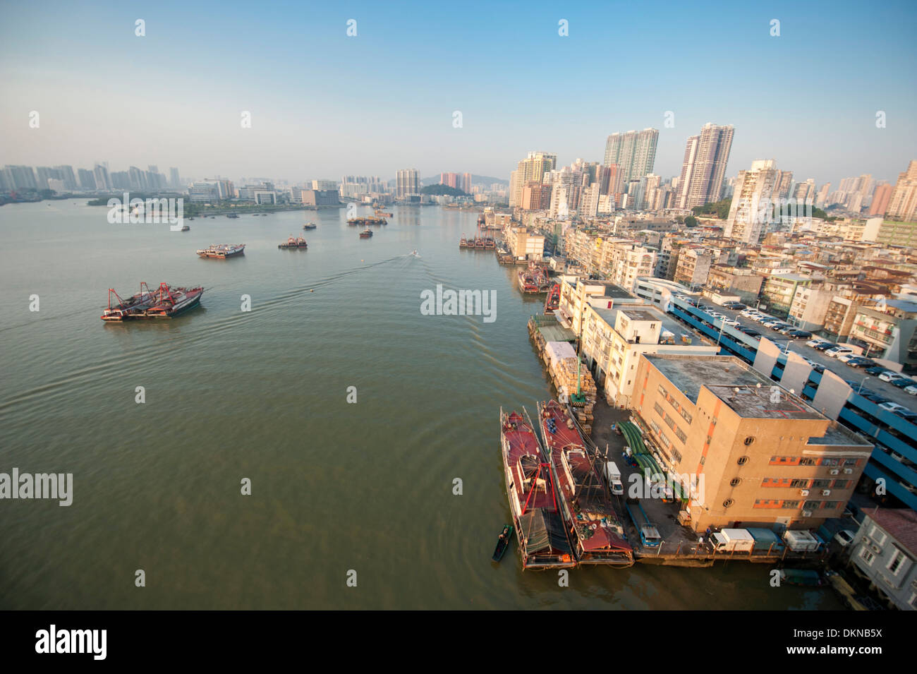 A bird's view of Macau's old inner port with quay buildings and ships ...