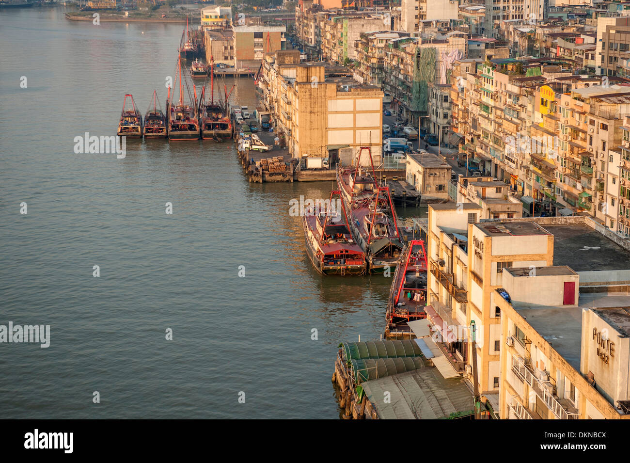 A bird's view of Macau's old inner port with quay buildings and ships ...