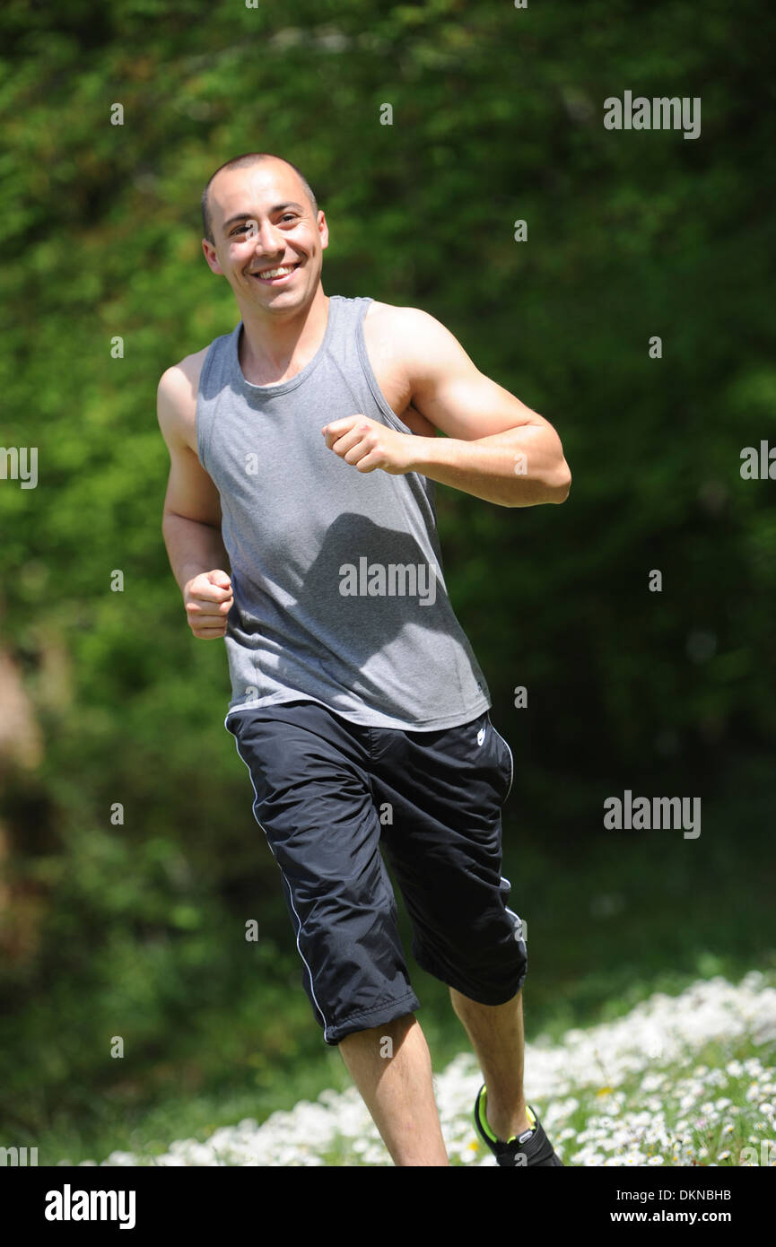 Muscular young man running outdoor hi-res stock photography and images ...