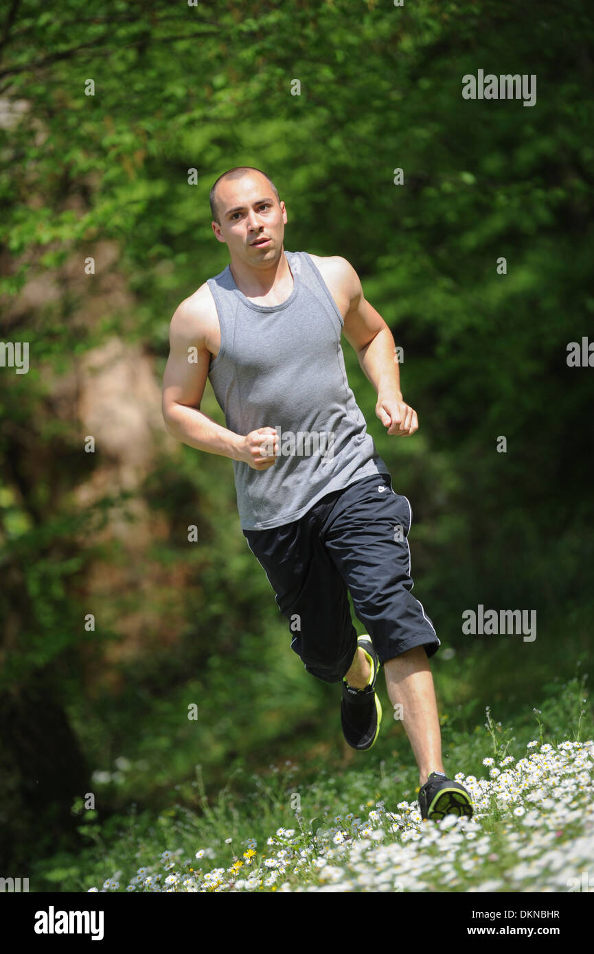 Man running in forest hi-res stock photography and images - Alamy