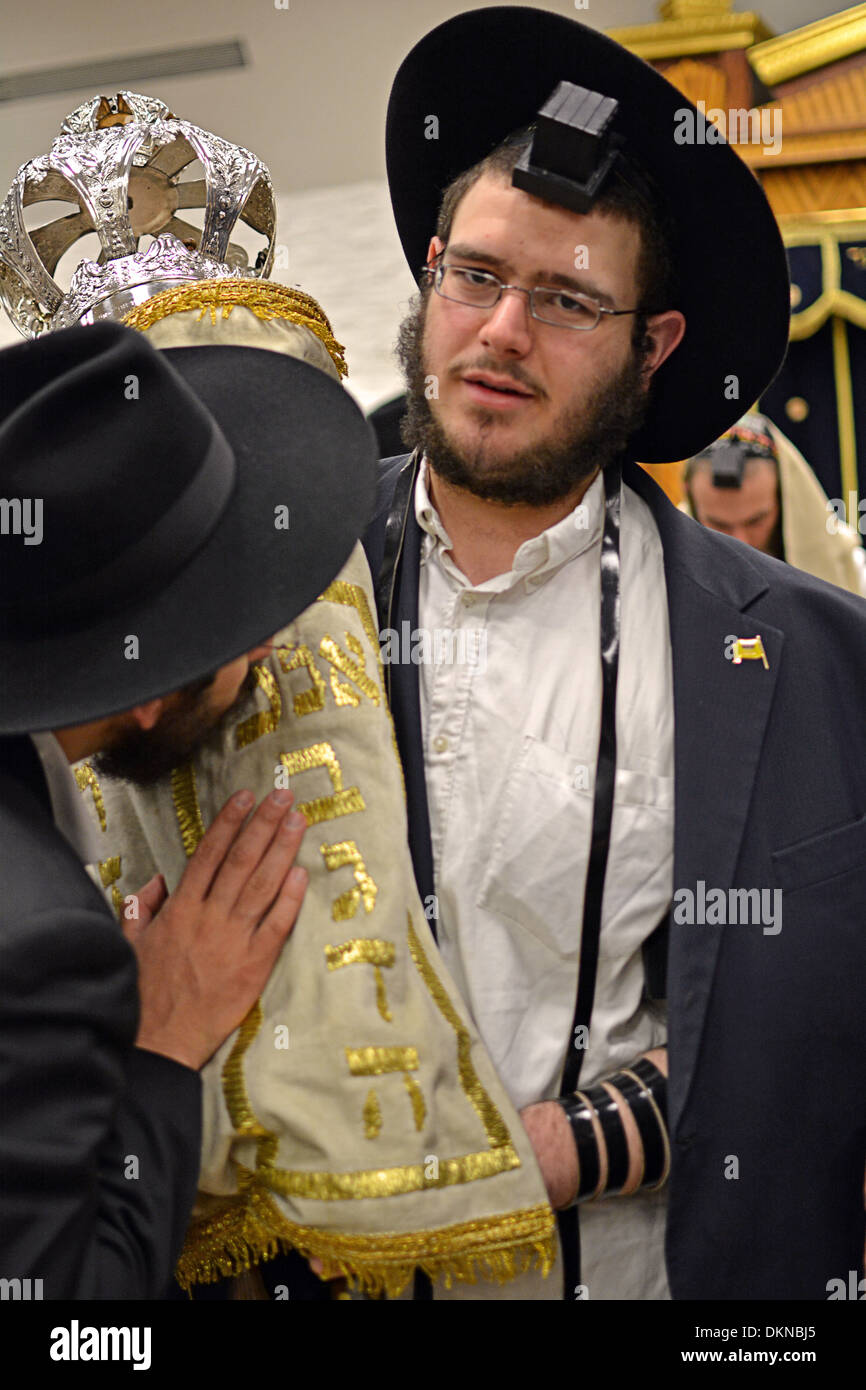 The Torah is kissed by religious Jewish worshipers at morning services ...