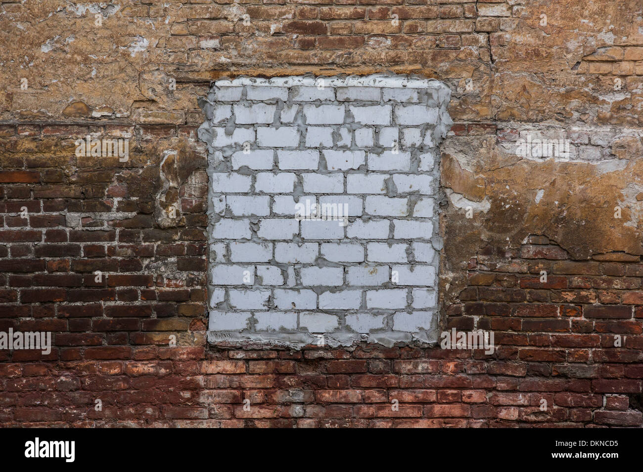 Broken window filled with new bricks at old wall Stock Photo - Alamy