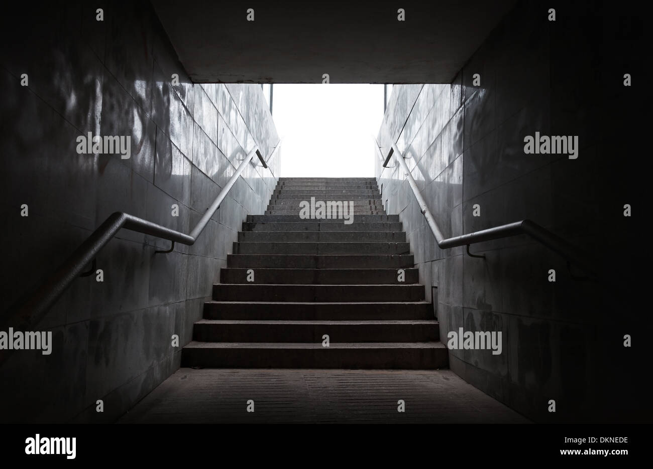 Underground passage with stairs in the glowing end Stock Photo - Alamy