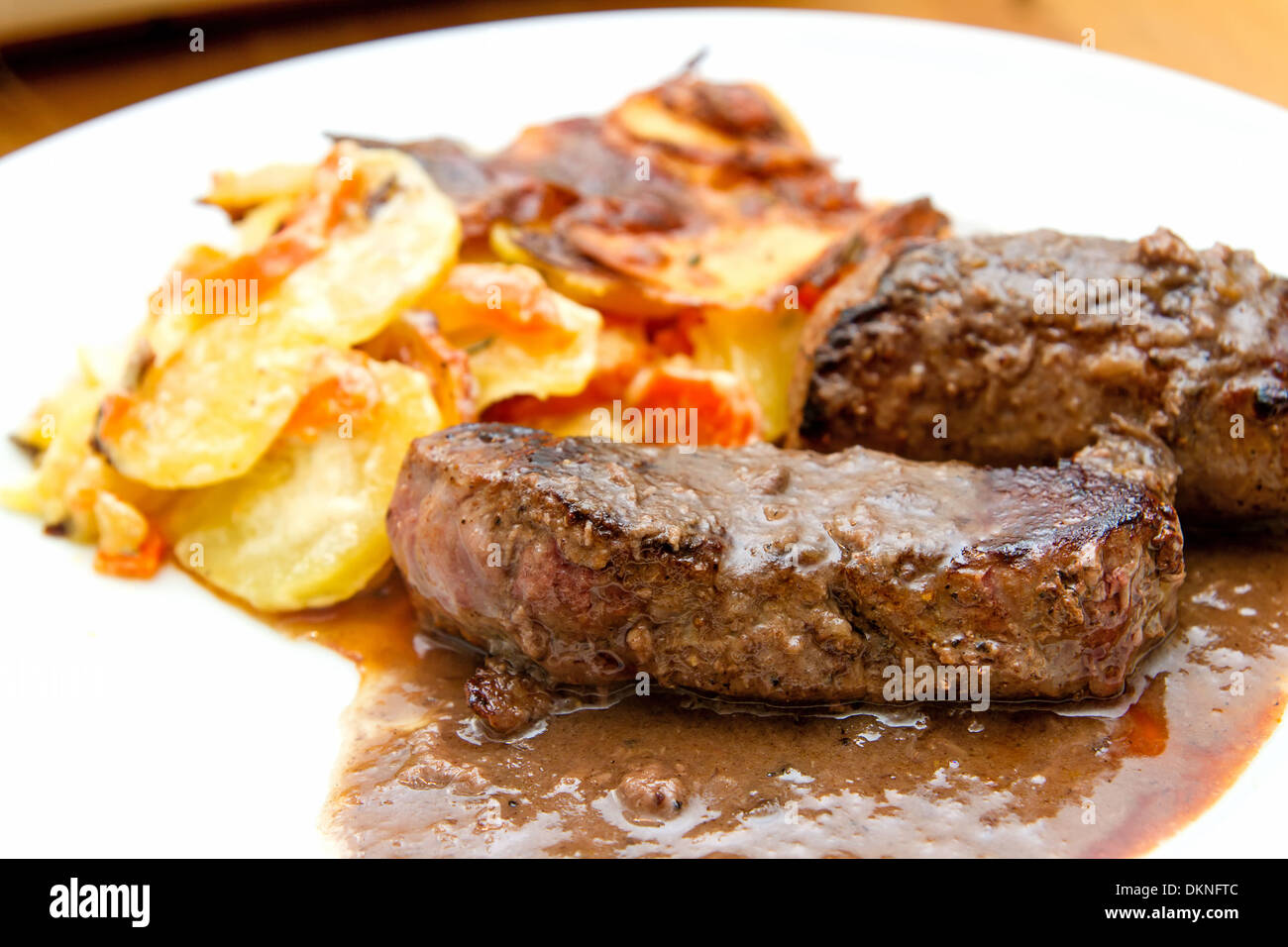 Venison fillet with potato gratin Stock Photo - Alamy