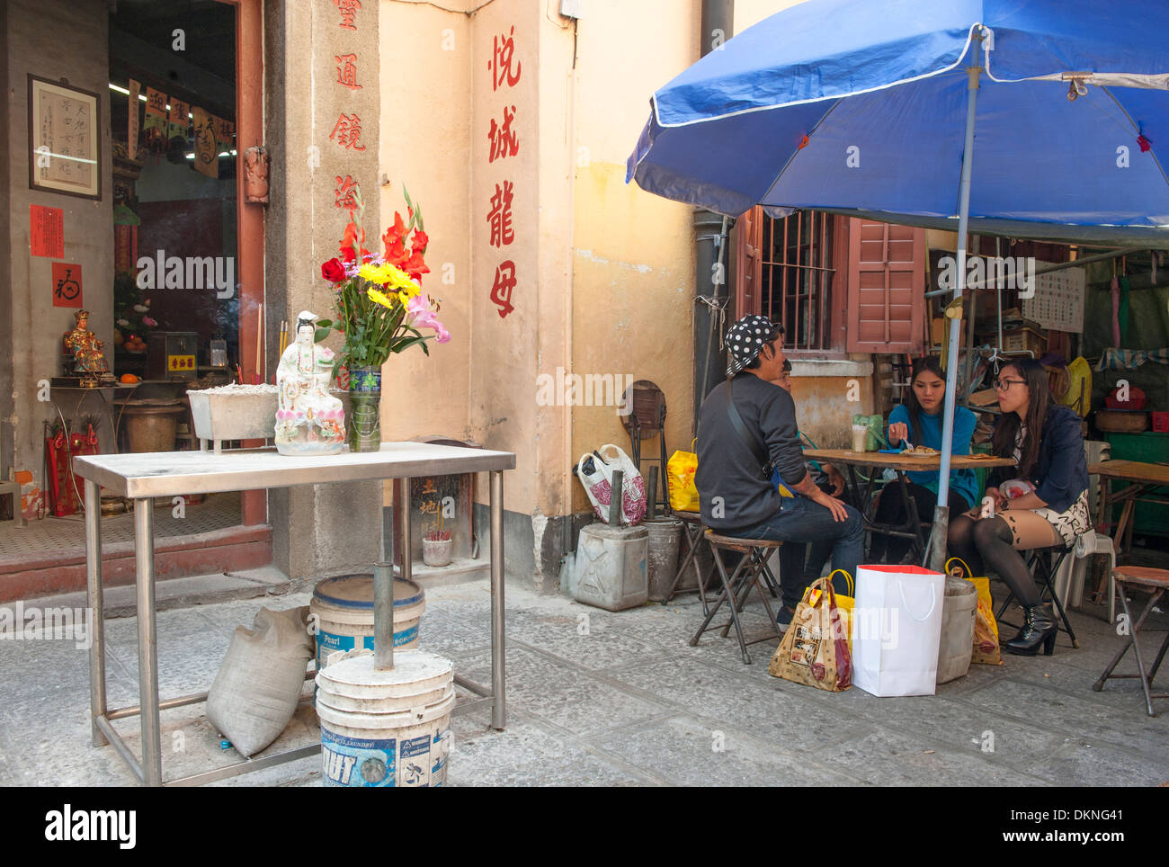 Open air dining at a simple food stall next to a temple in the UNESCO ...