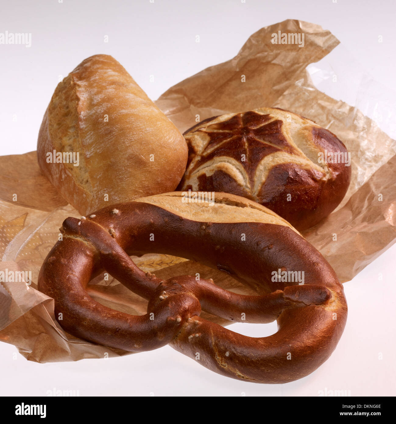 german lye rolls and bread roll on a bag in light back Stock Photo - Alamy