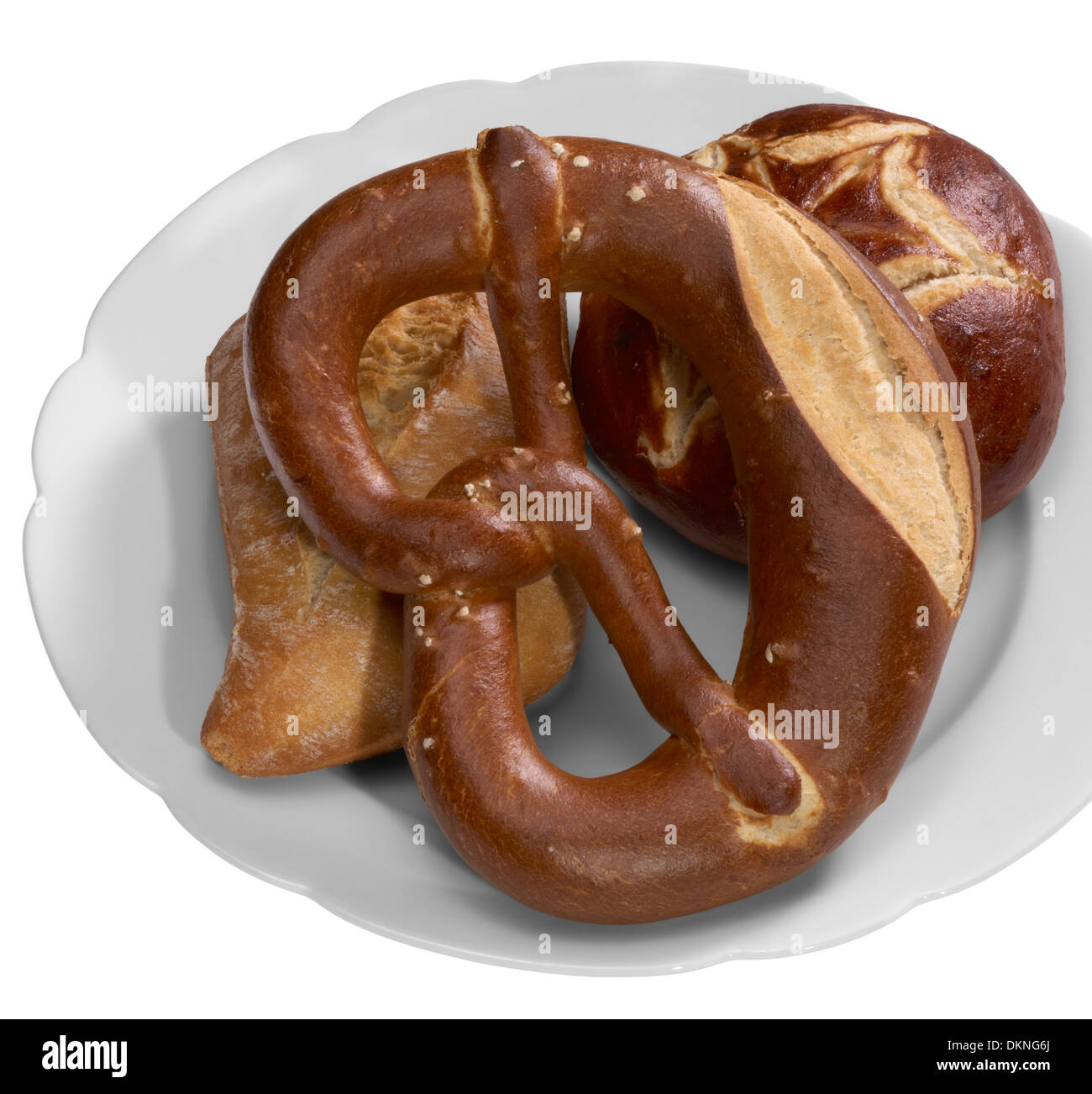 german lye rolls and bread roll on a white plate Stock Photo - Alamy
