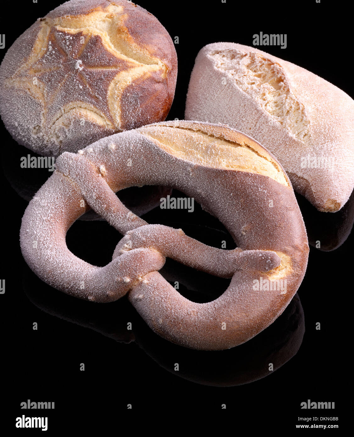 frozen german lye rolls and bread roll in light back Stock Photo - Alamy