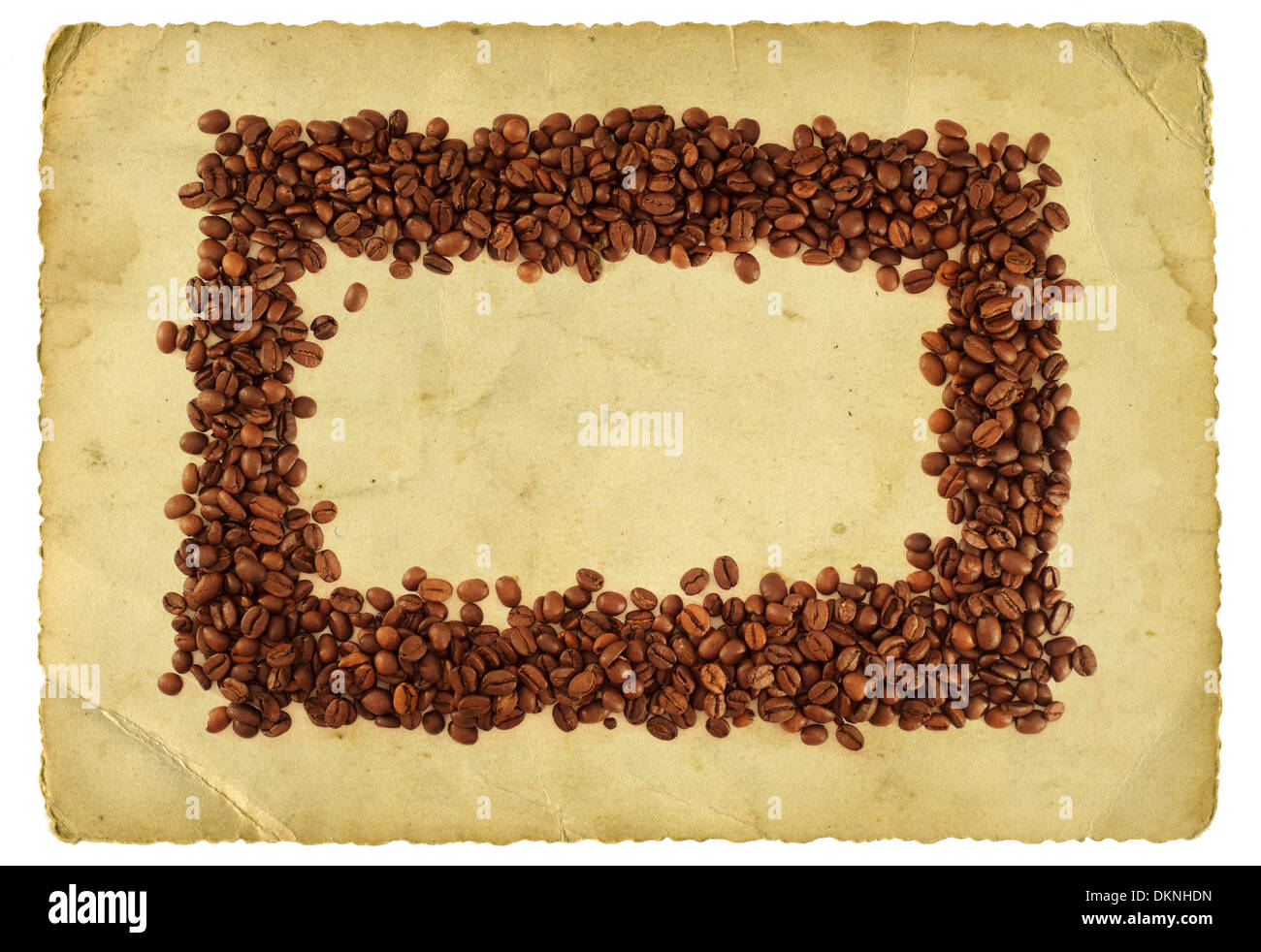 Coffee beans on old paper background Stock Photo - Alamy