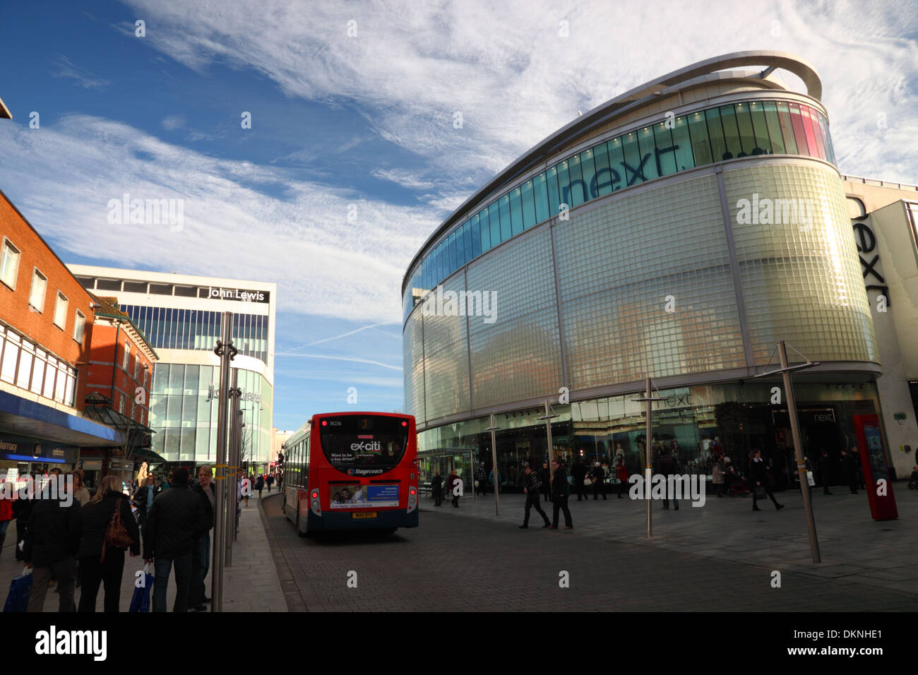 A modern city centre with a 'bus and new John Lewis and Next stores ...