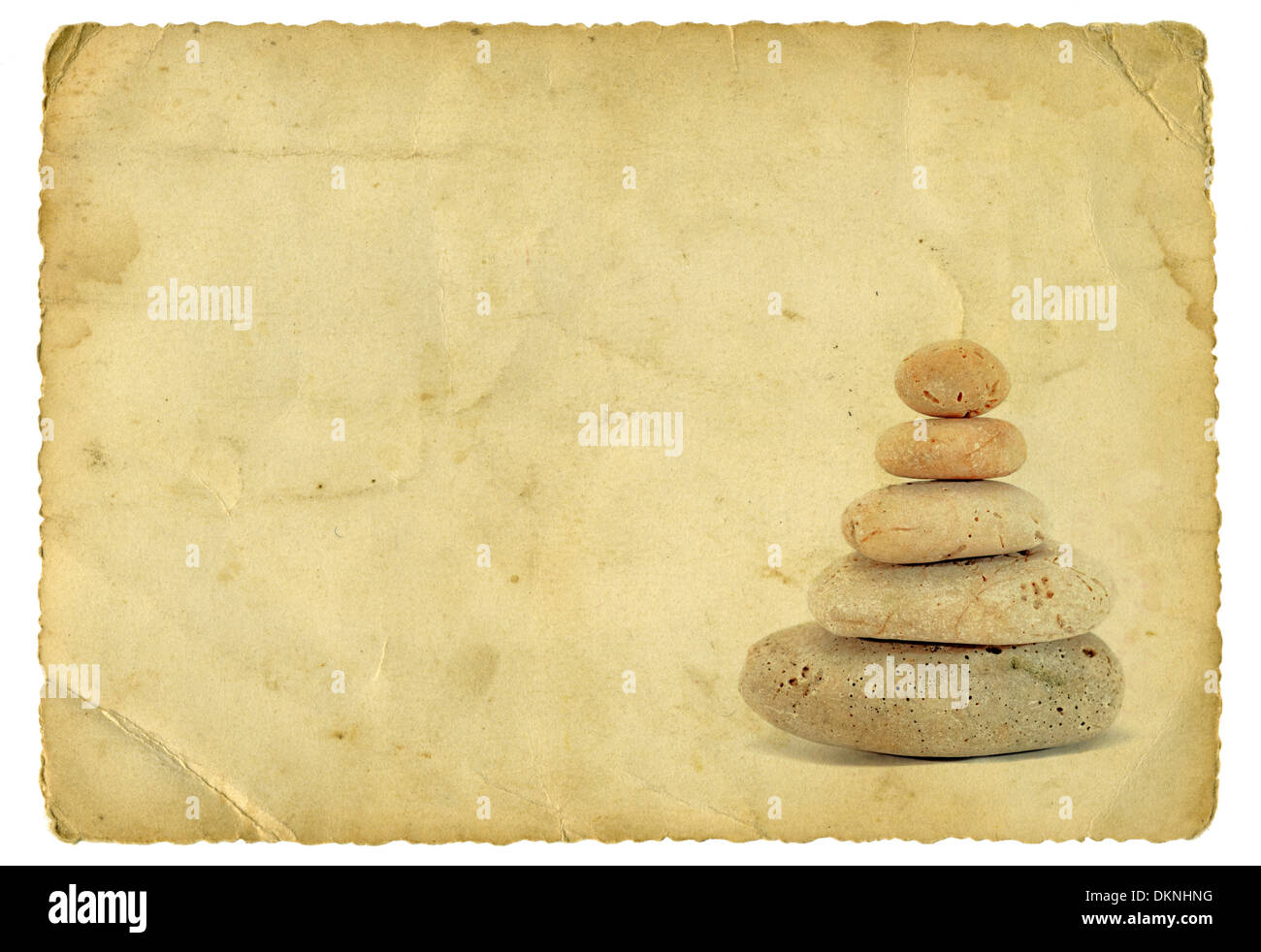 Stack of stones on old paper background Stock Photo - Alamy
