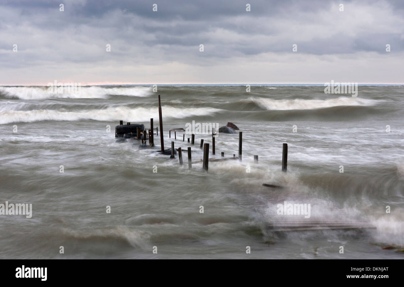Wooden bridge in a stormy and wavy sea Stock Photo - Alamy