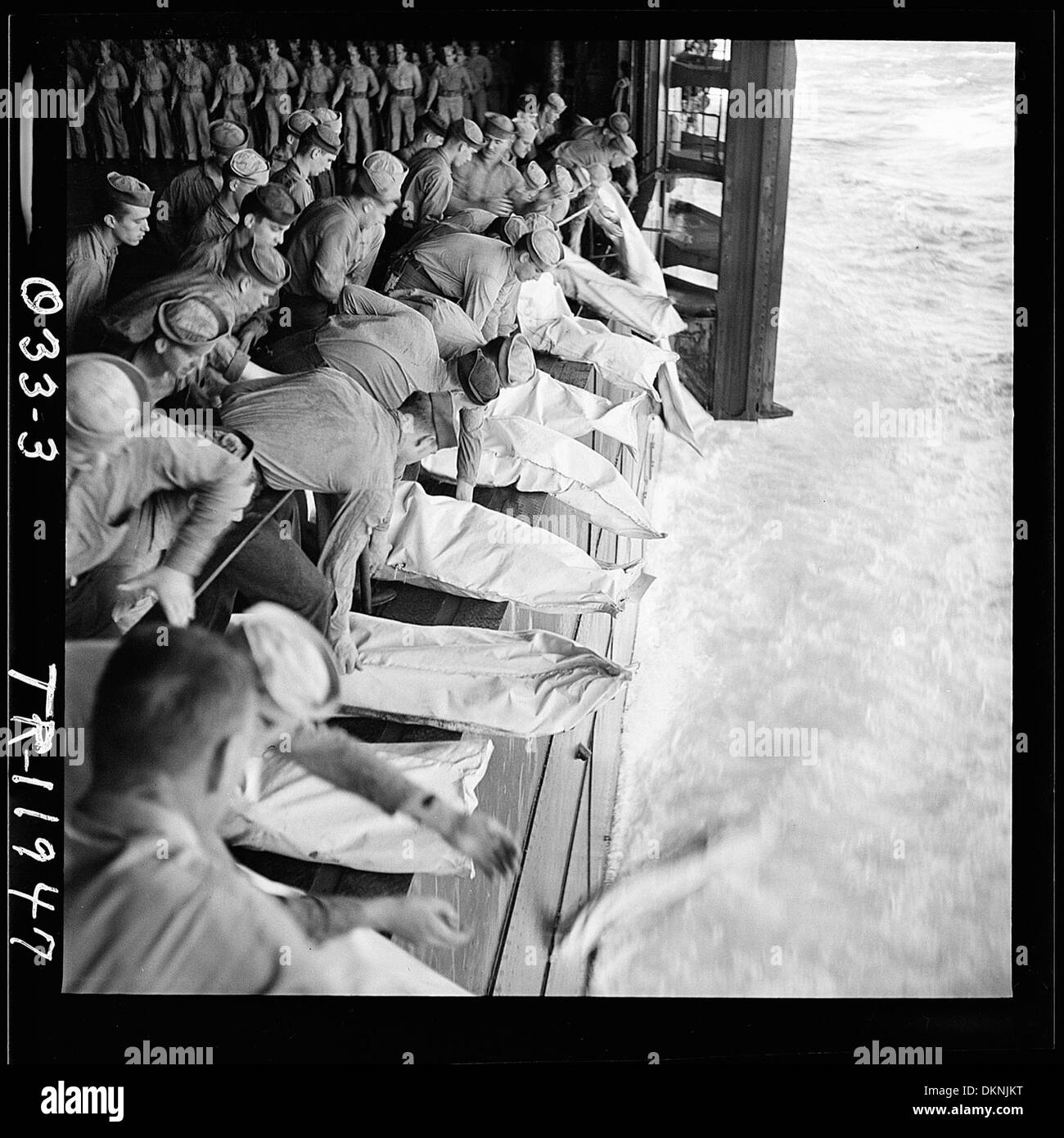 The burial at sea of officers and men from the USS Intrepid (CV-11) who ...