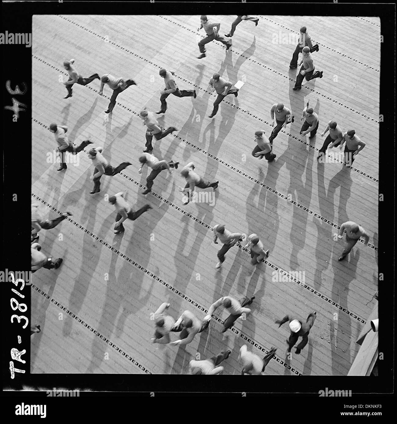 Crewmen aboard the USS Yorktown (CV-10) rush to their stations as the ...