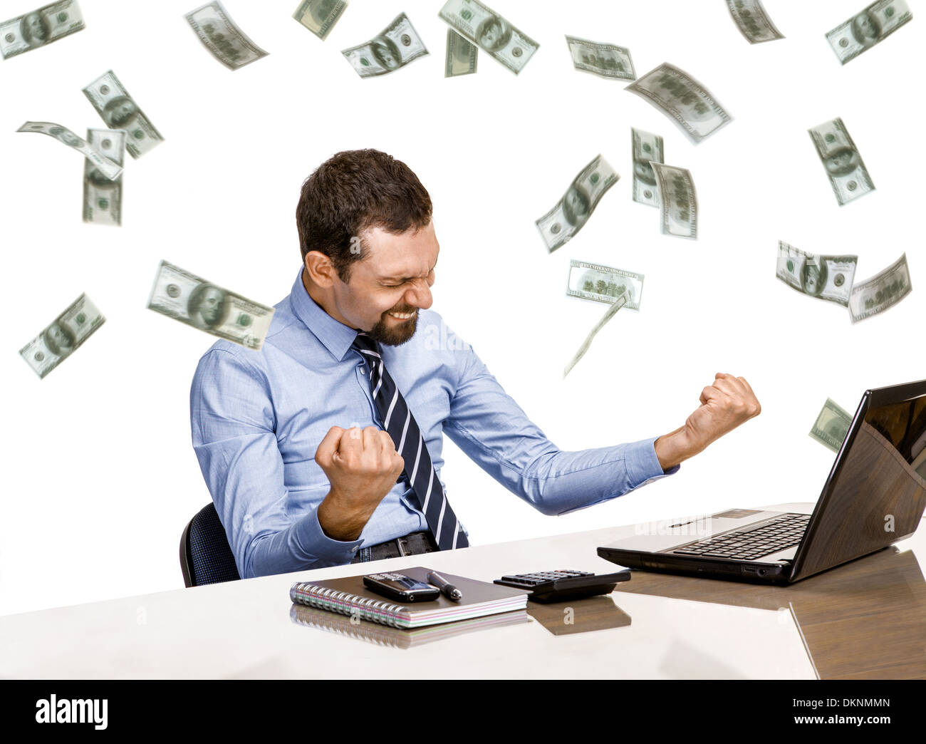 Young modern businessman excited with his success while working with ...