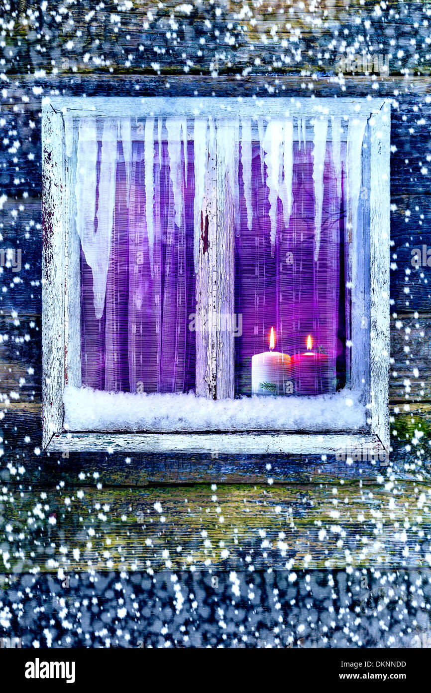 Lit candles in the window. Time Christmas and New Year Stock Photo - Alamy