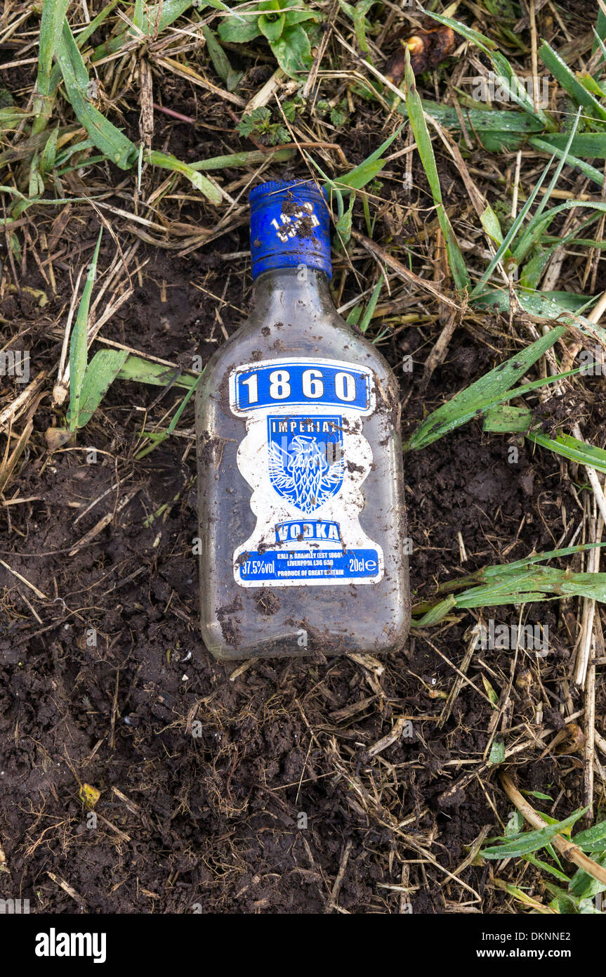 Discarded empty Vodka alcohol bottle Stock Photo - Alamy