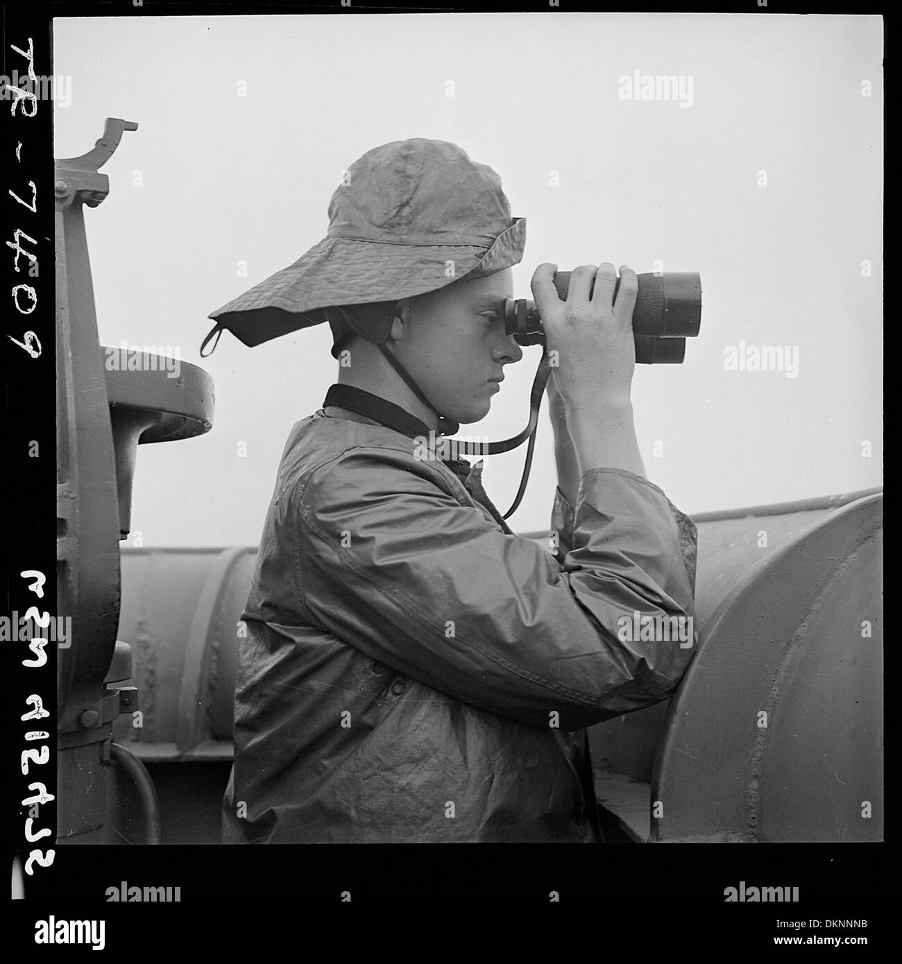 Lawrence Britton (SN2) is pictured on duty at a port lookout aboard the ...