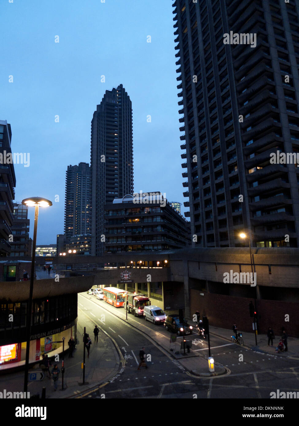 A view of the Barbican residential towers above a lit up Beech Street ...