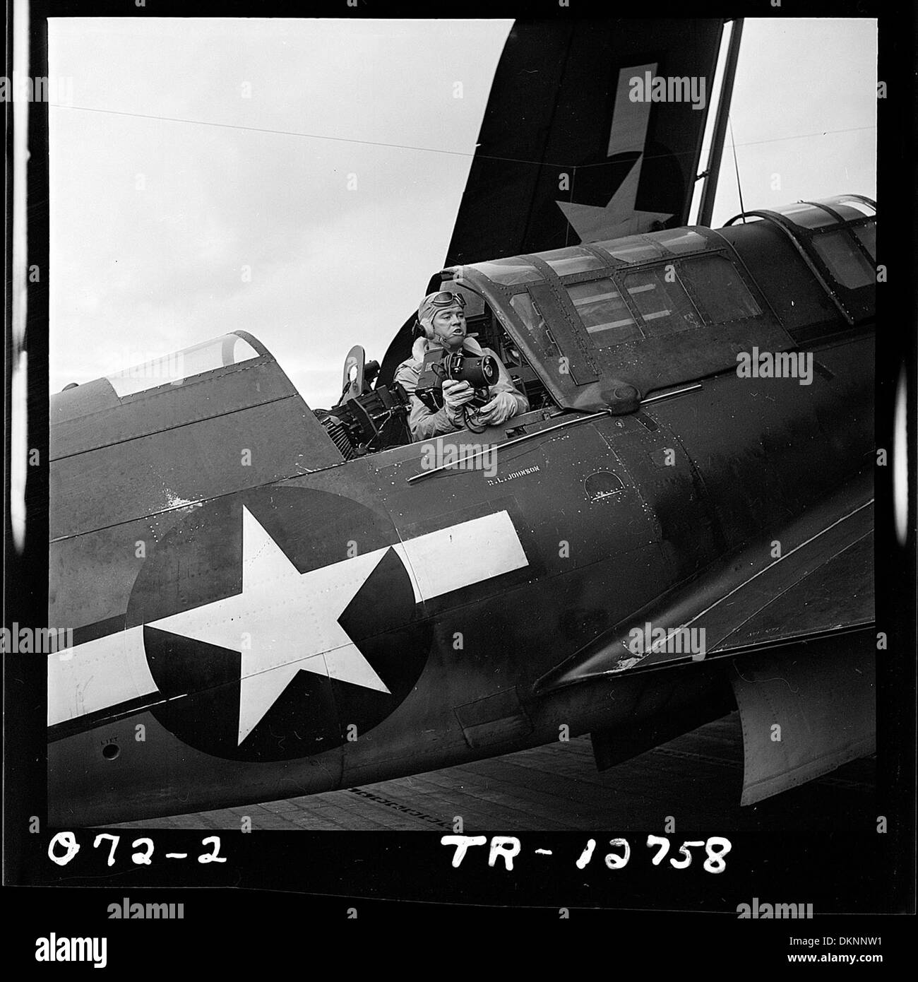 Lieutenant Barrett Gallagher is pictured in the rear seat of an SB2C ...