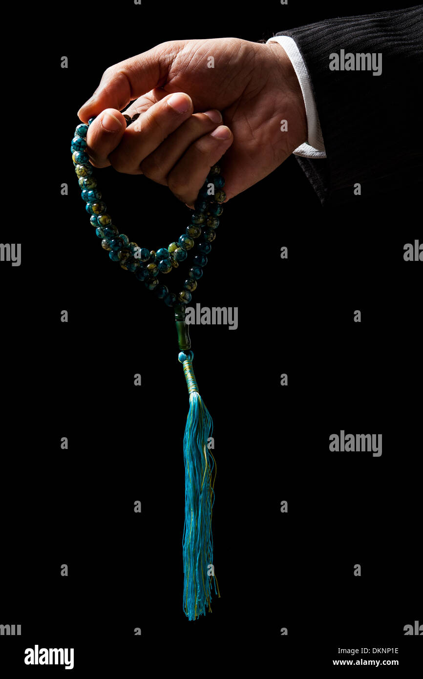 Hand holding muslim hi-res stock photography and images - Alamy