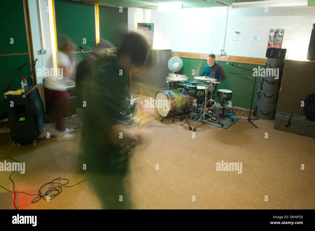 A band practicing in a music rehearsal studio Stock Photo - Alamy