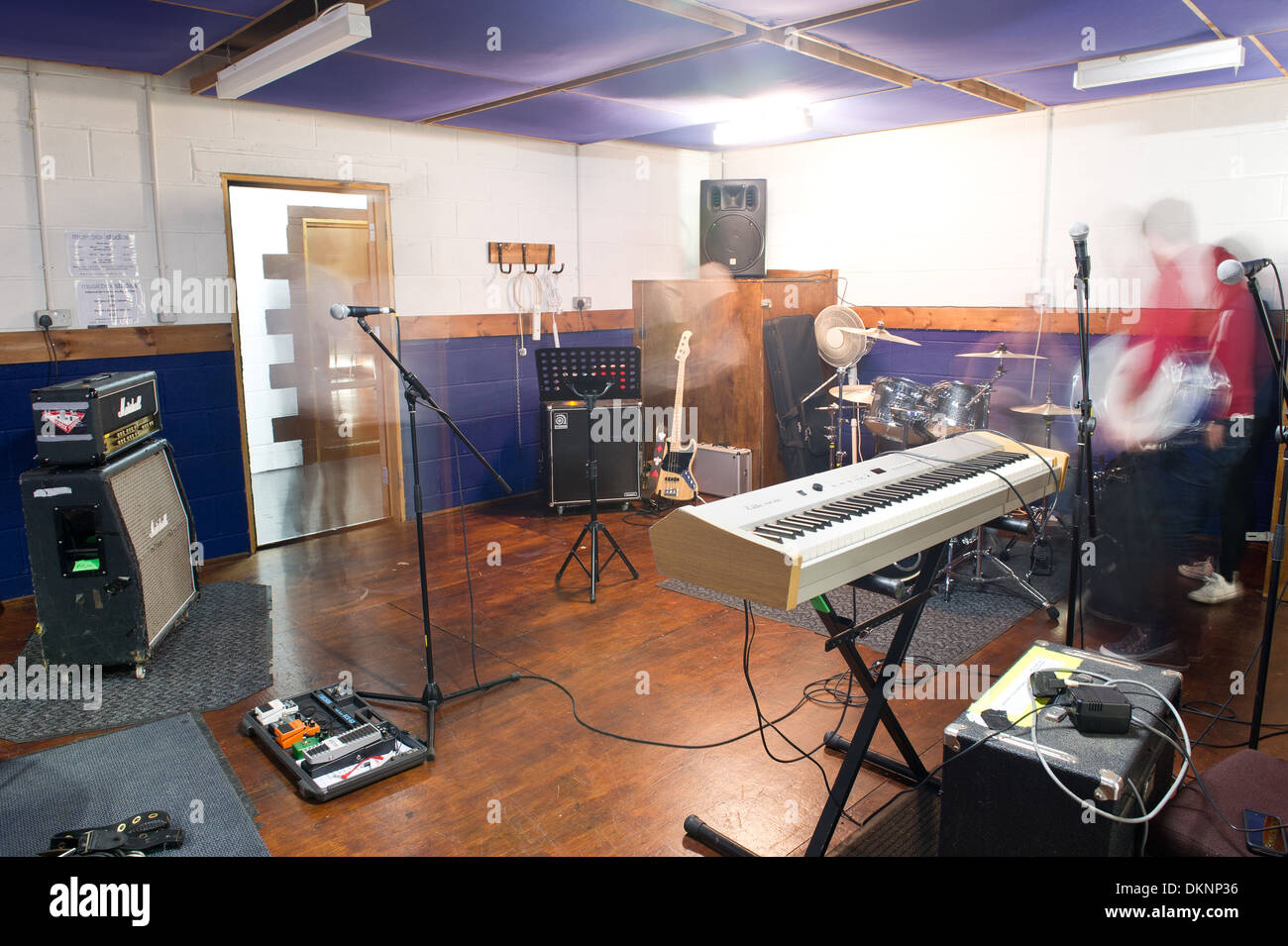 A band practicing in a music rehearsal studio Stock Photo - Alamy