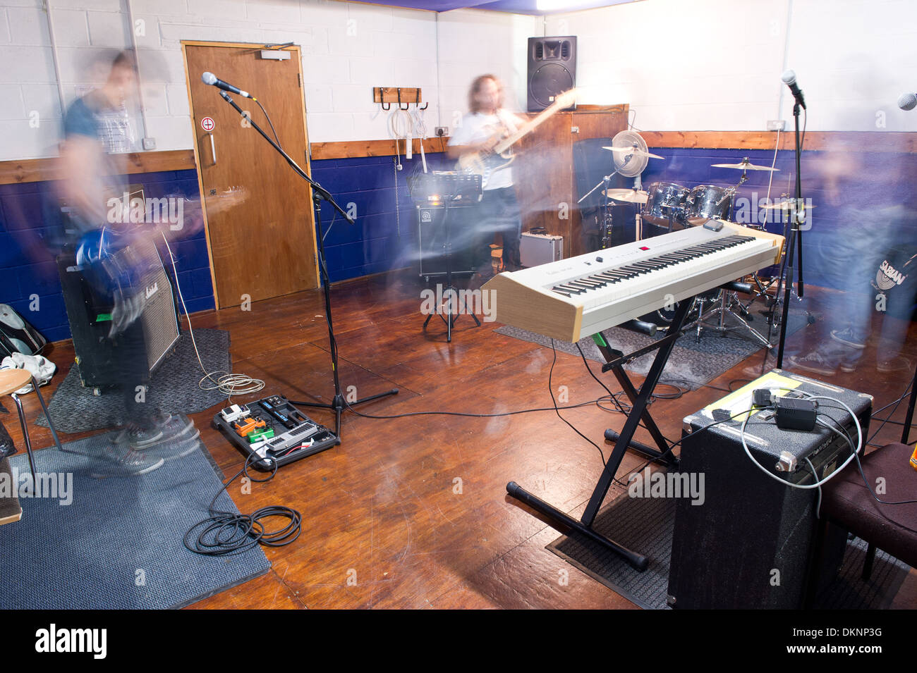 A band practicing in a music rehearsal studio Stock Photo - Alamy