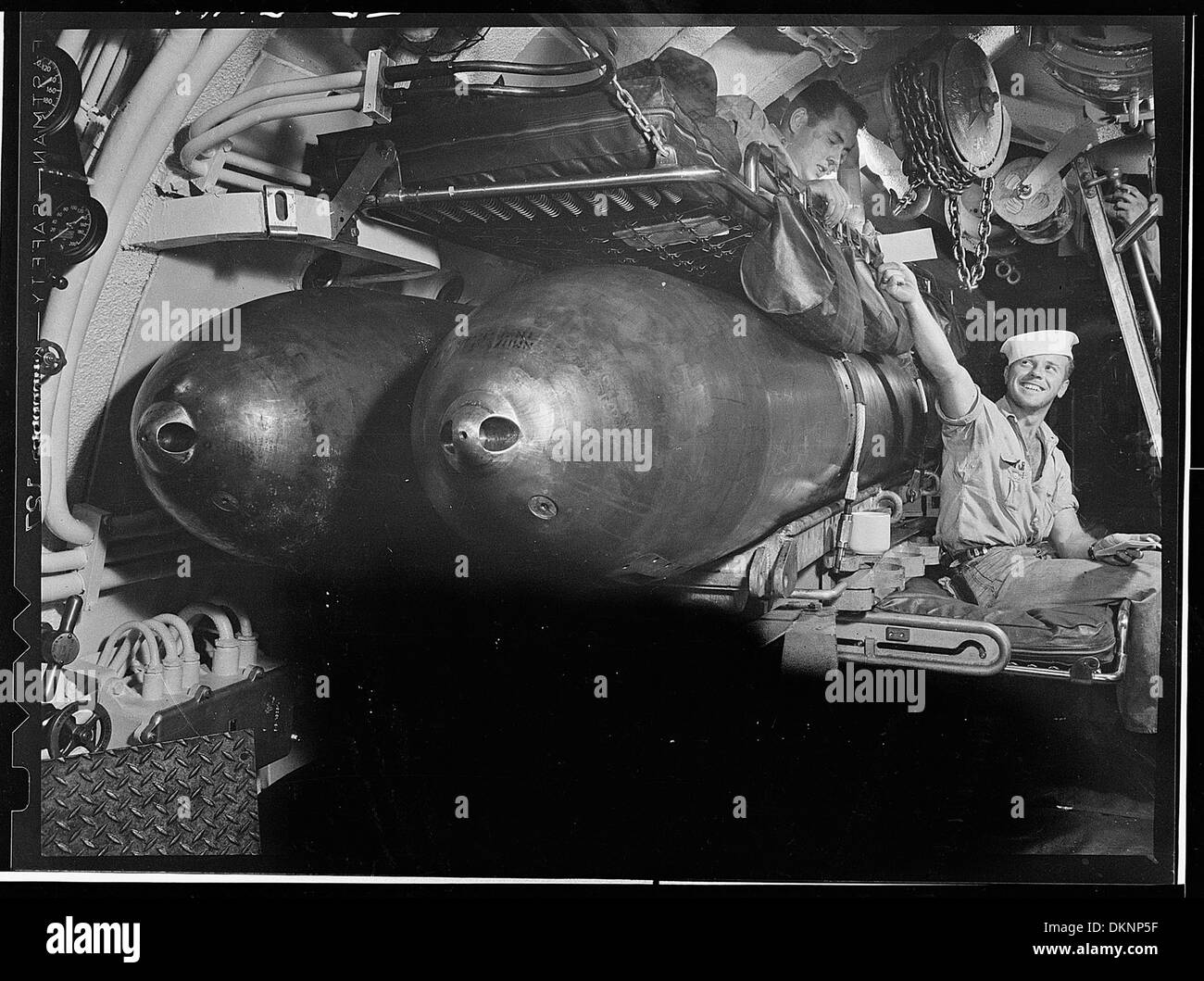This photograph shows crew members aboard the USS Cero (SS-225 ...