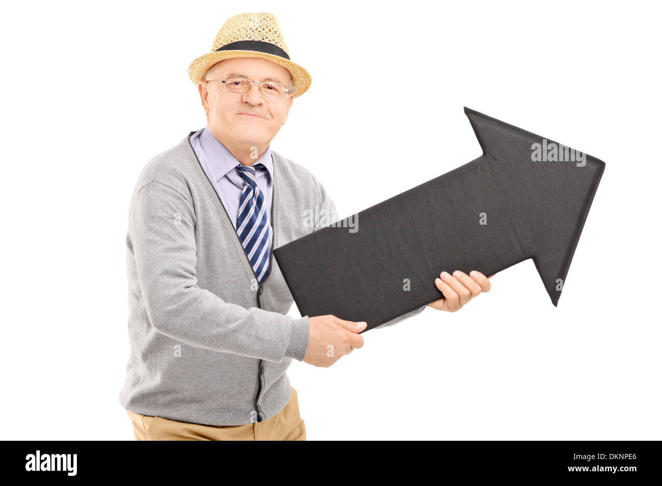 Happy senior gentleman holding a big black arrow Stock Photo - Alamy