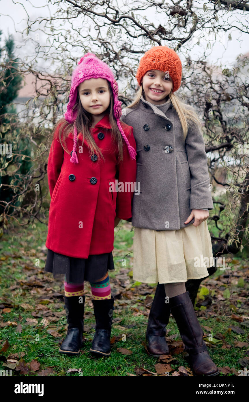 Two cute retro girls posing Stock Photo - Alamy