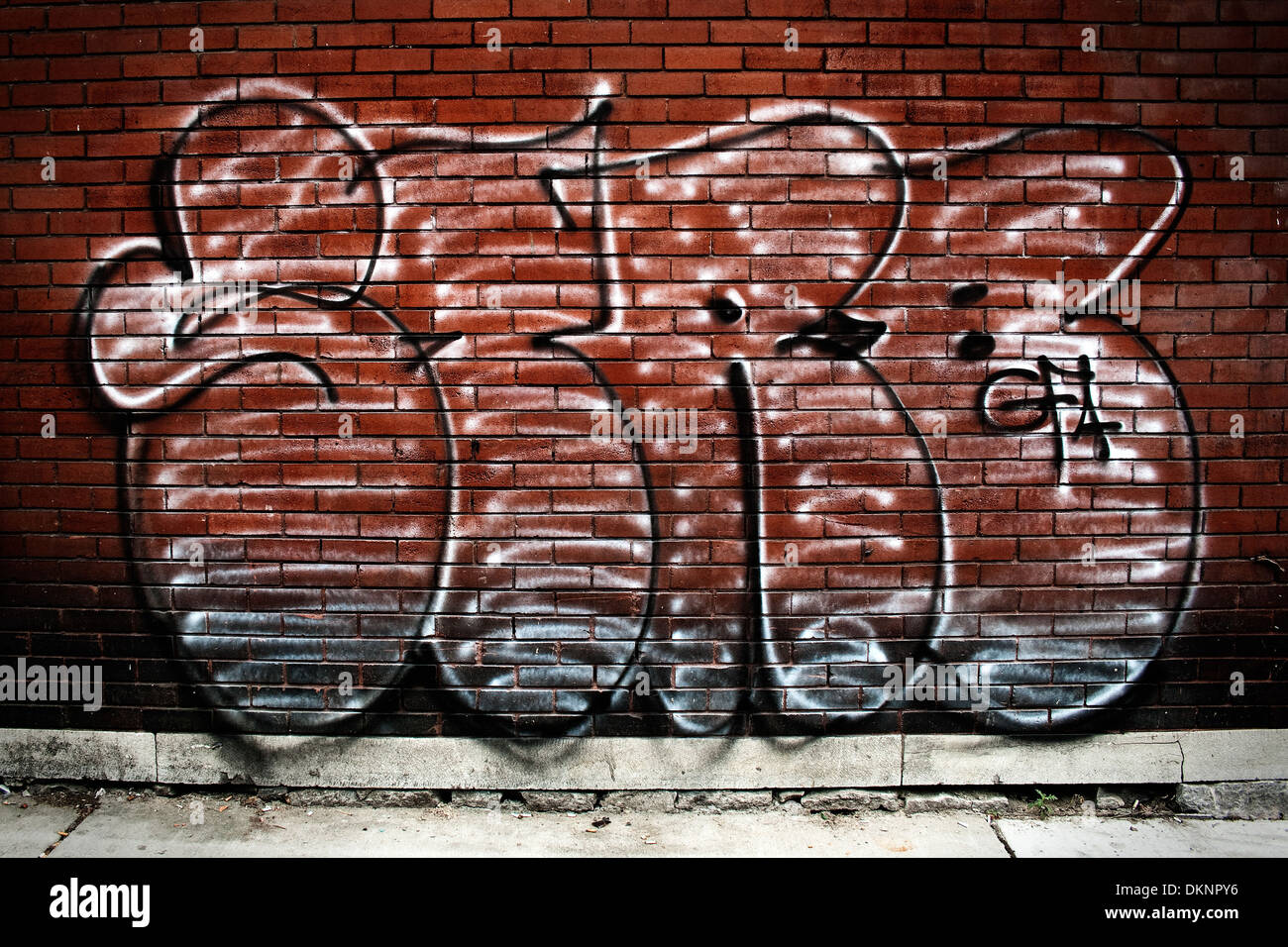 Street graffiti on an exterior brick wall, "STR8" (straight Stock Photo ...