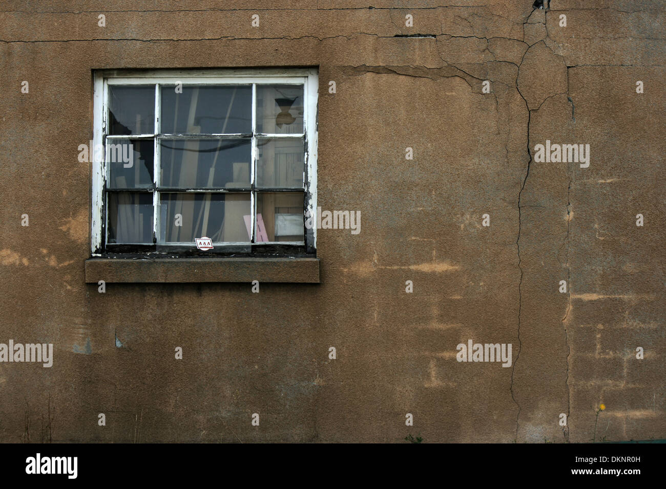 Exterior wall and broken glass window of a rundown warehouse Stock ...
