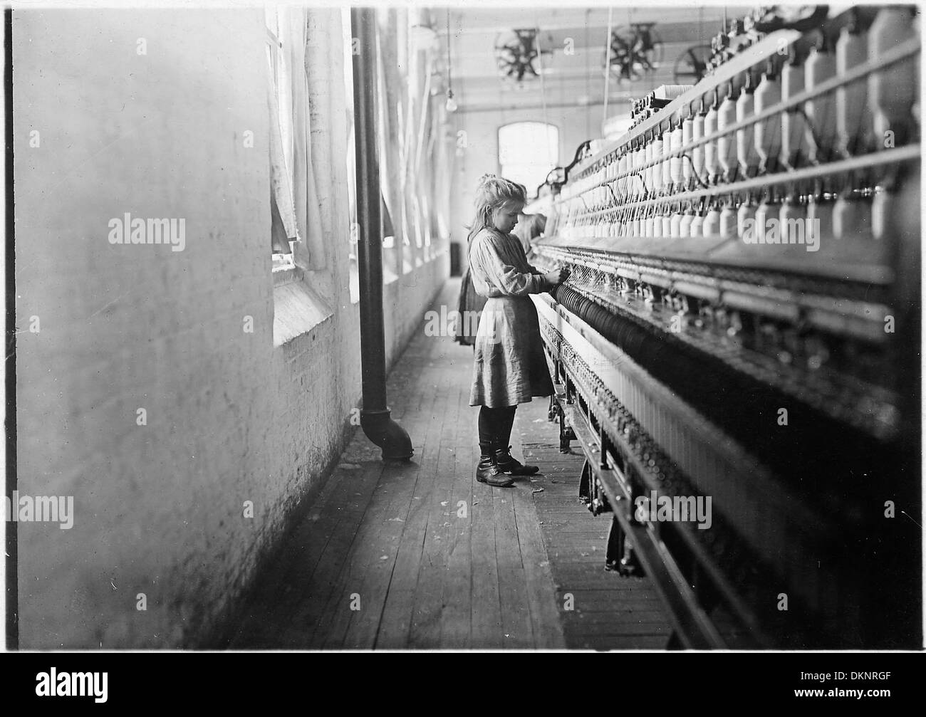 A child spinner working at the Lancaster Cotton Mills in South Carolina ...