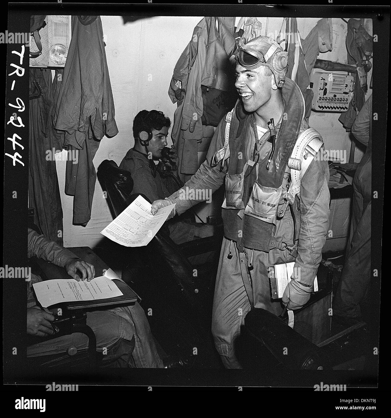 The image captures the ready room aboard the USS Lexington (CV-16), an ...