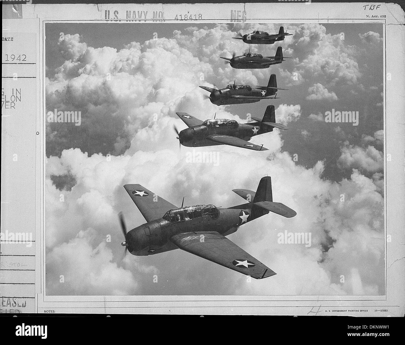 TBF aircraft are seen flying in a perfect echelon formation over ...