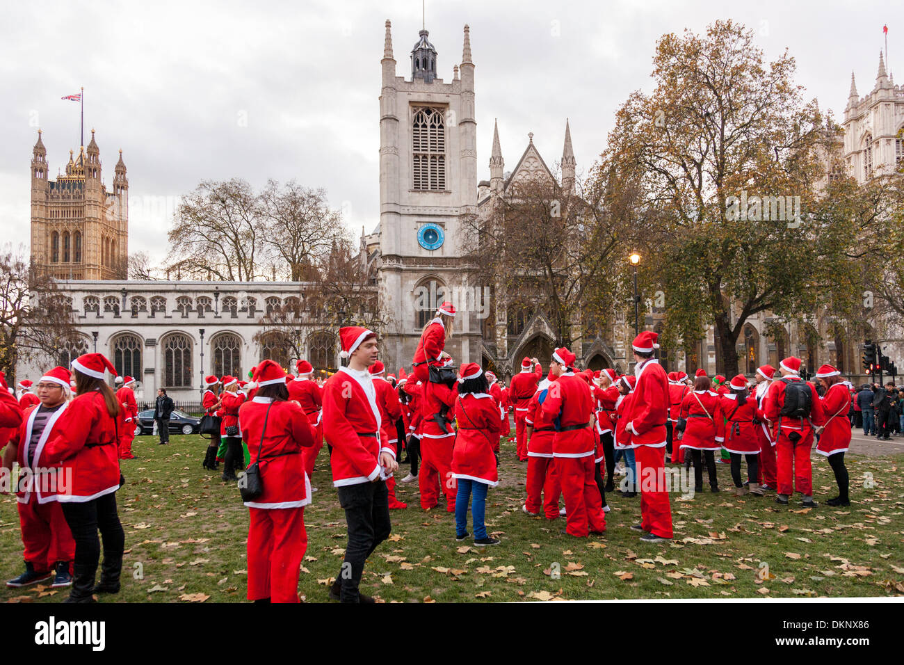London, UK. 8th Dec 2013. Santa Clause Parade in Parliament Square ...