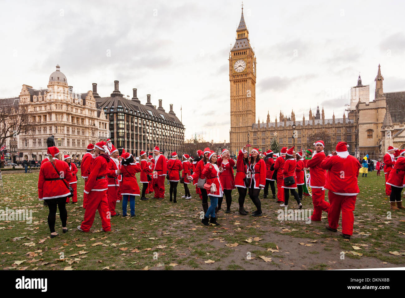 London, UK. 8th Dec 2013. Santa Clause Parade in Parliament Square ...
