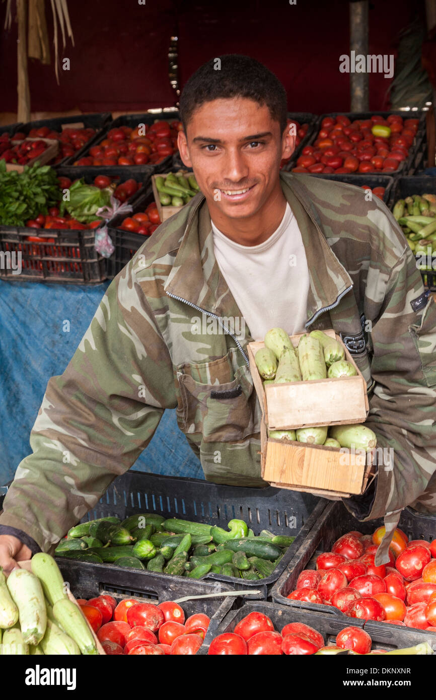 Libya, Tripoli. Young Man Selling Cucumbers, Tomatoes, and Squash at a ...