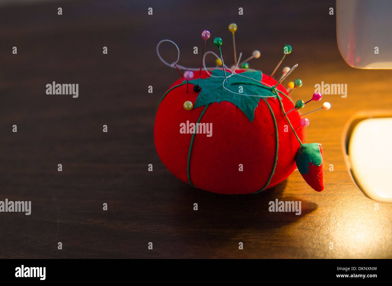 Let's sew! an vintage tomato pin cushion Stock Photo - Alamy
