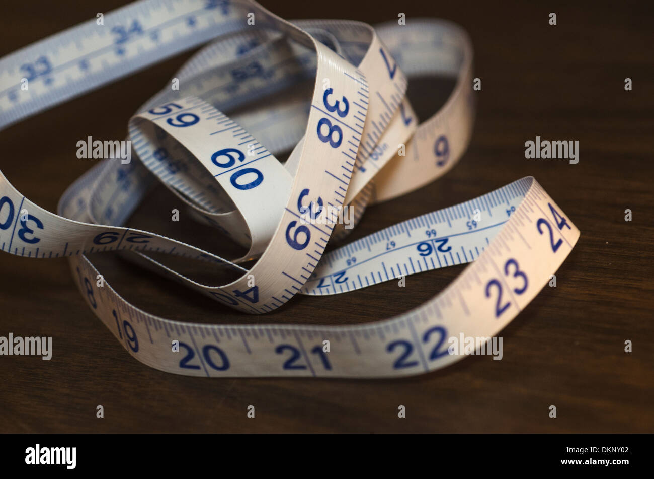 Measuring tape and sewing Stock Photo - Alamy