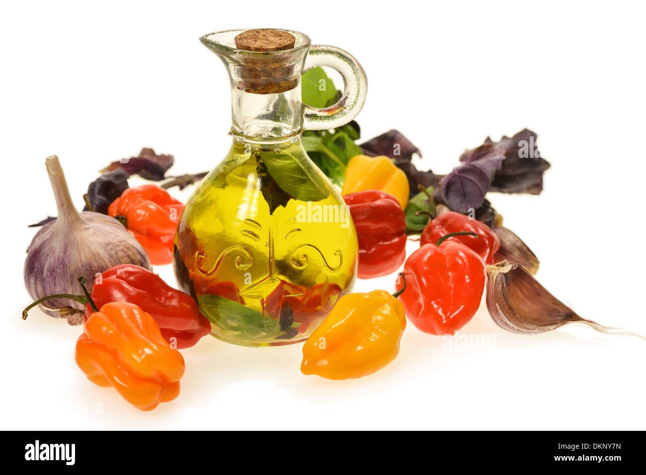 Olive oil with pepper, garlic and basil - ingredients Stock Photo - Alamy