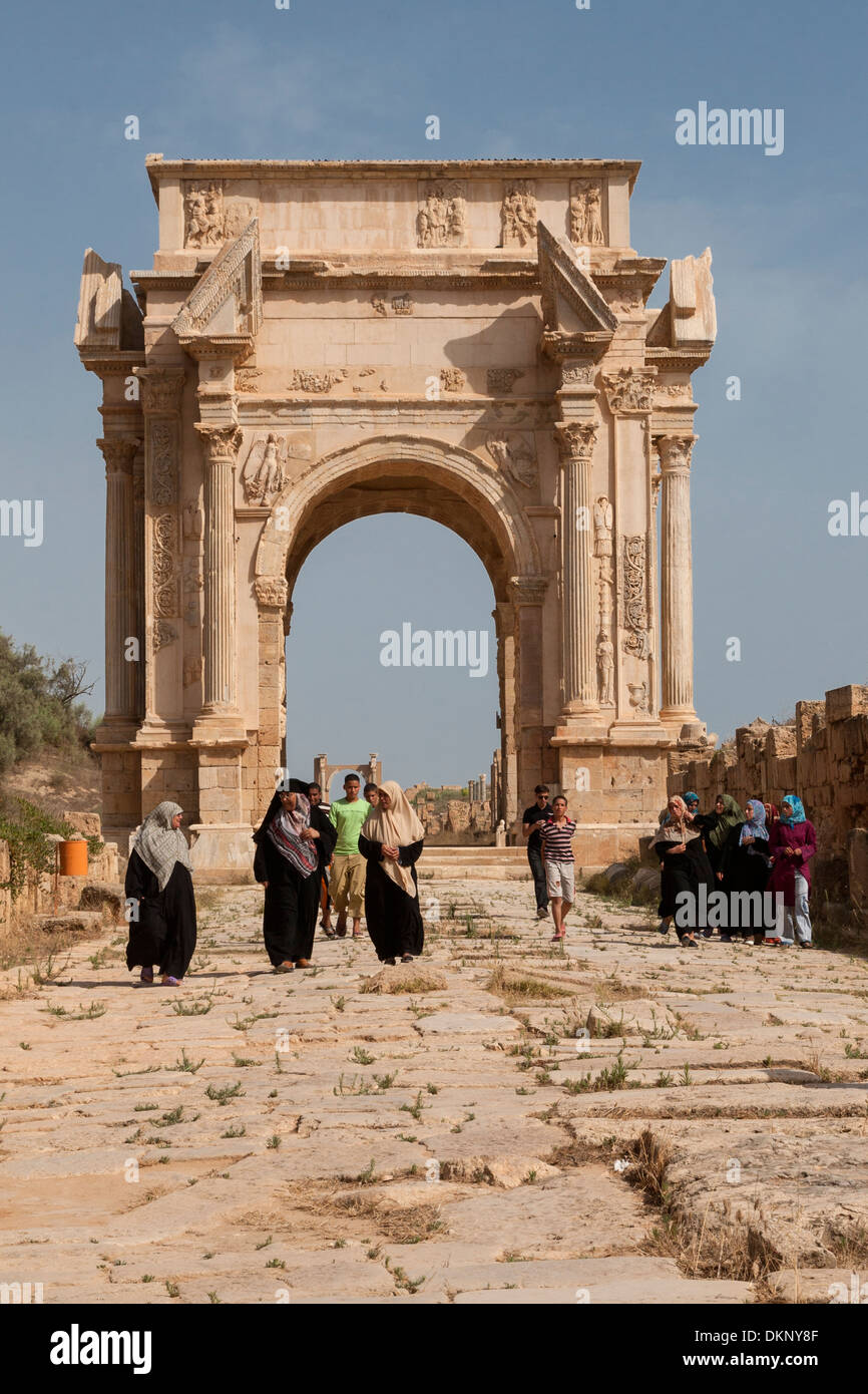 Libya, Leptis Magna. Libyan Women Walking Past the Arch of Marcus ...
