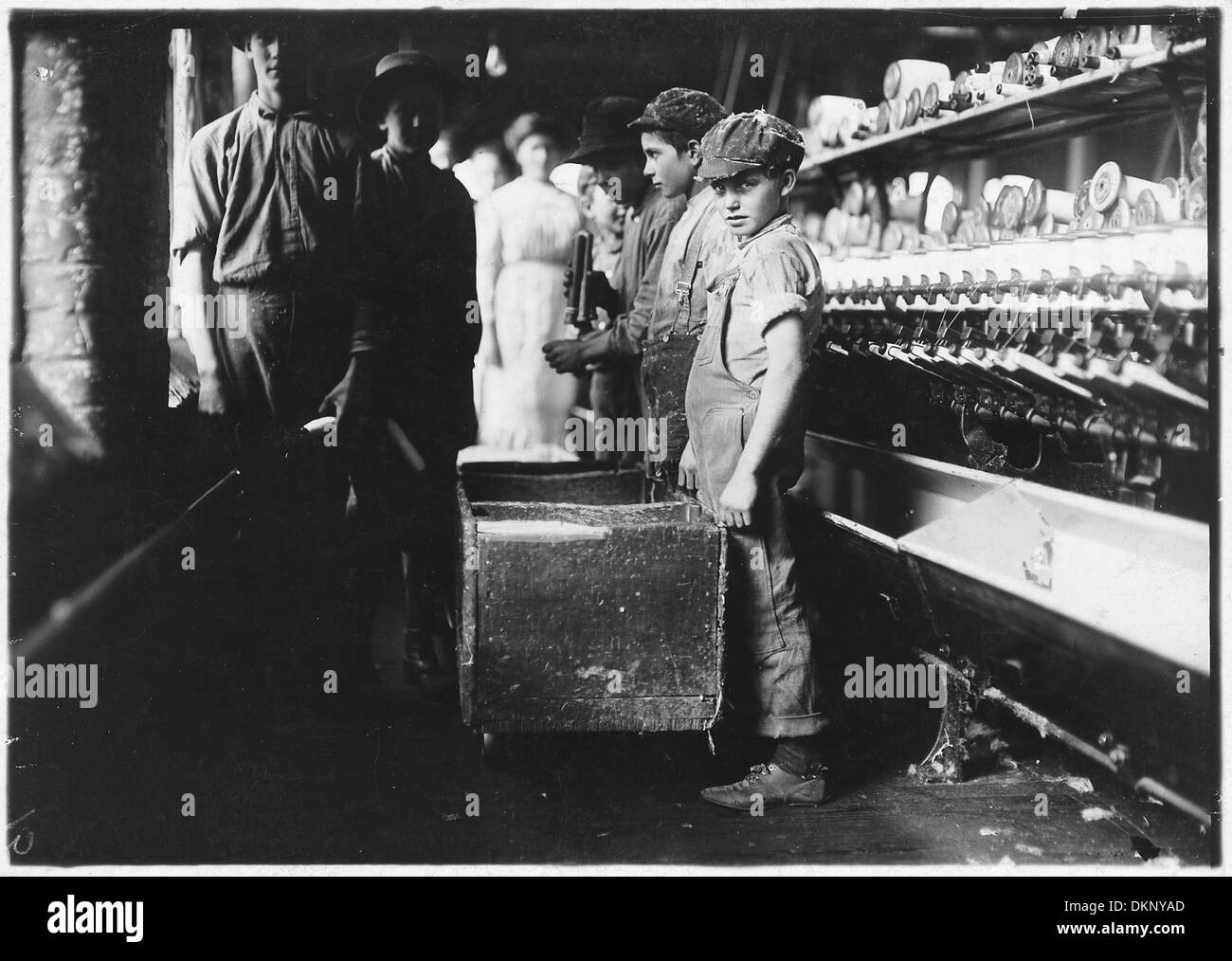 This image depicts young doffers working at the Elk Cotton Mills in ...