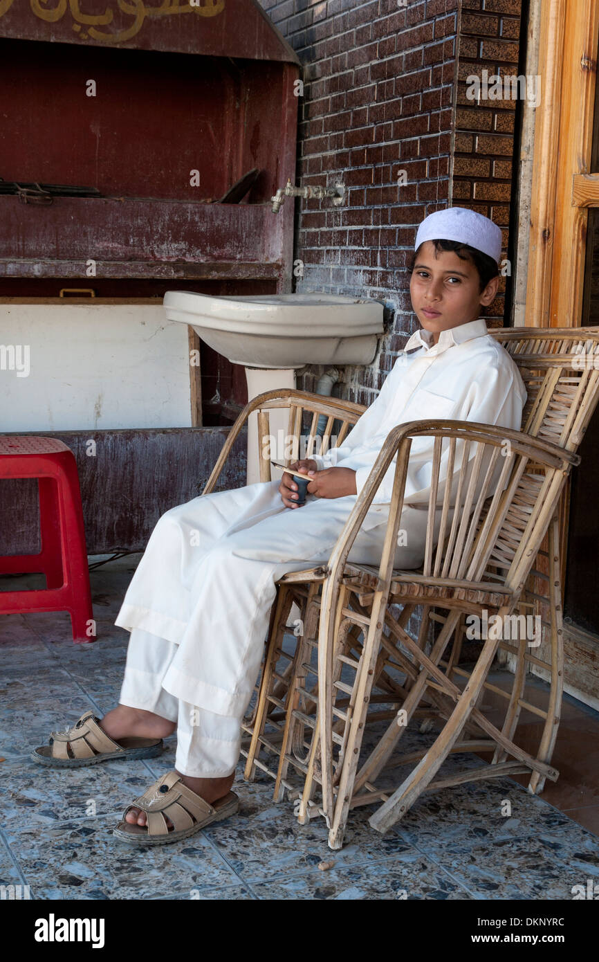 Libya, Zliten. Libyan Boy in Traditional Hat and Juba, a lightweight ...