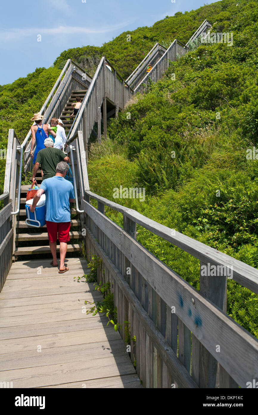 Walking up the famous hundred steps that climb Mohegan Bluffs, a ...